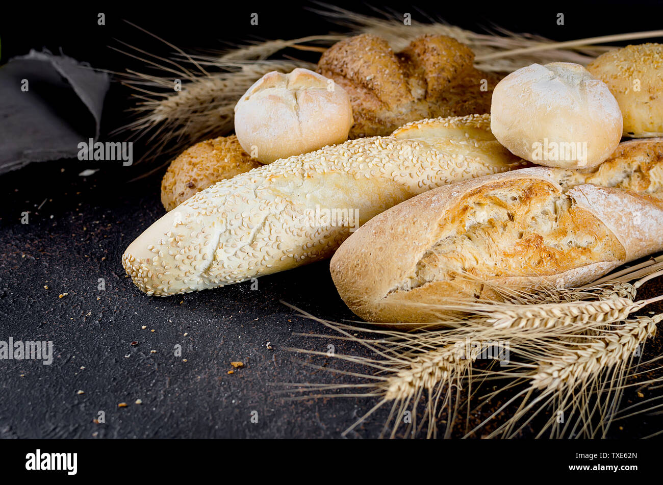 assortment of different types of bread, loaf, baguettes, loaves, rolls ...