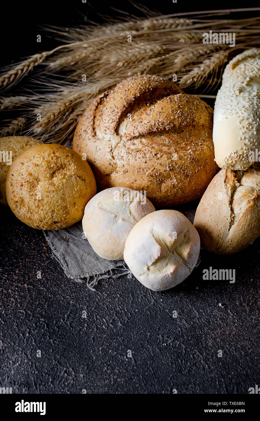 assortment of different types of bread, loaf, baguettes, loaves, rolls ...