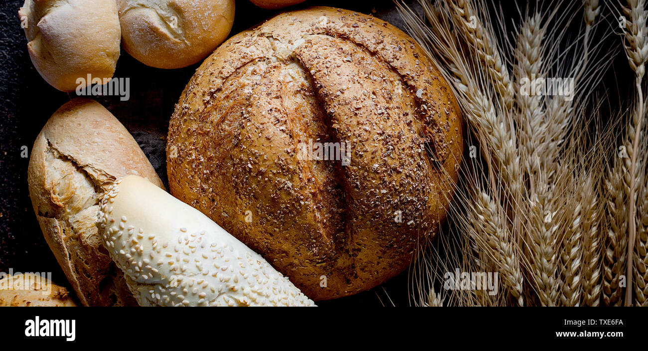 assortment of different types of bread, loaf, baguettes, loaves, rolls ...