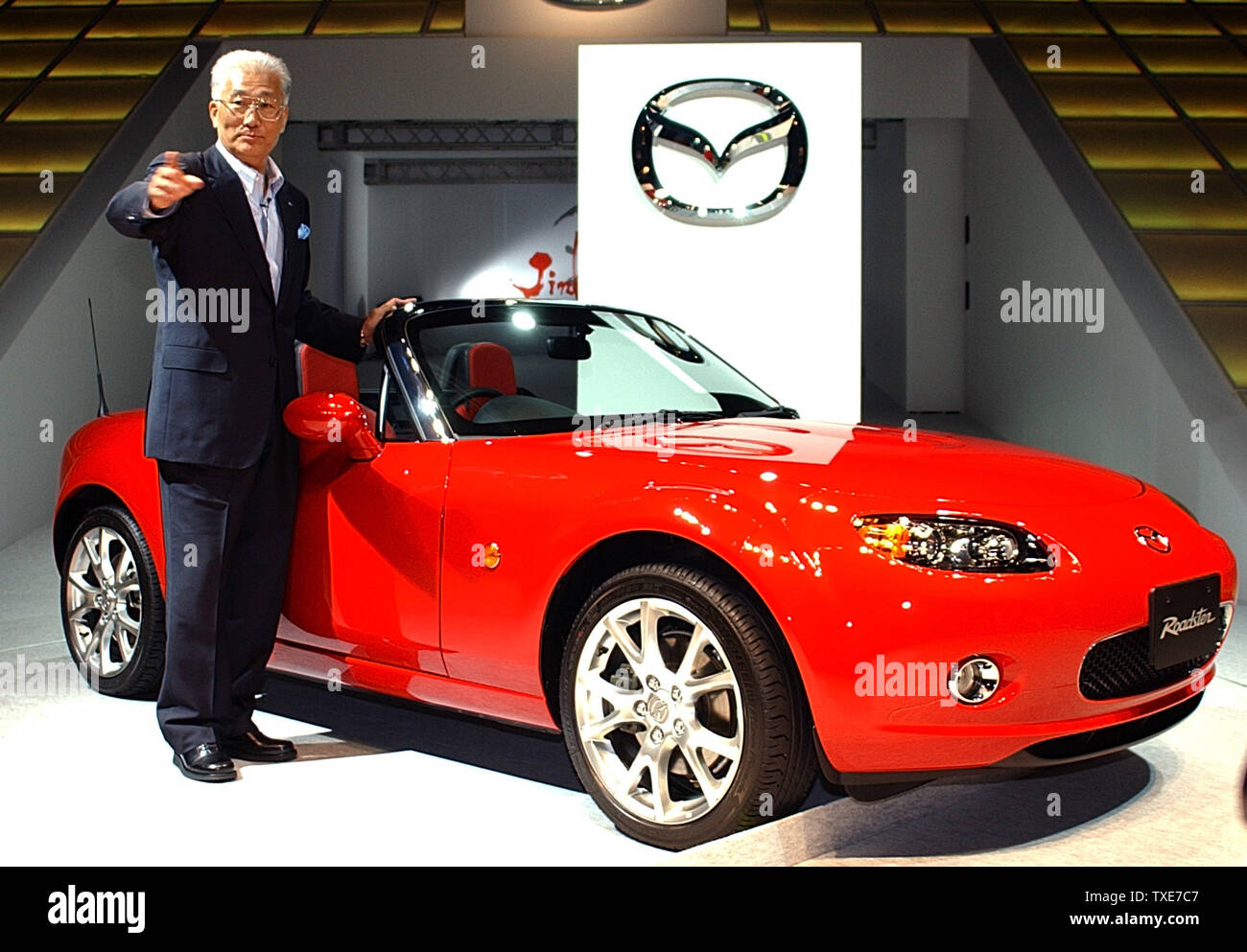 Hisakazu Imaki, Director and CEO of Mazda Motor Corporation, shows off ...