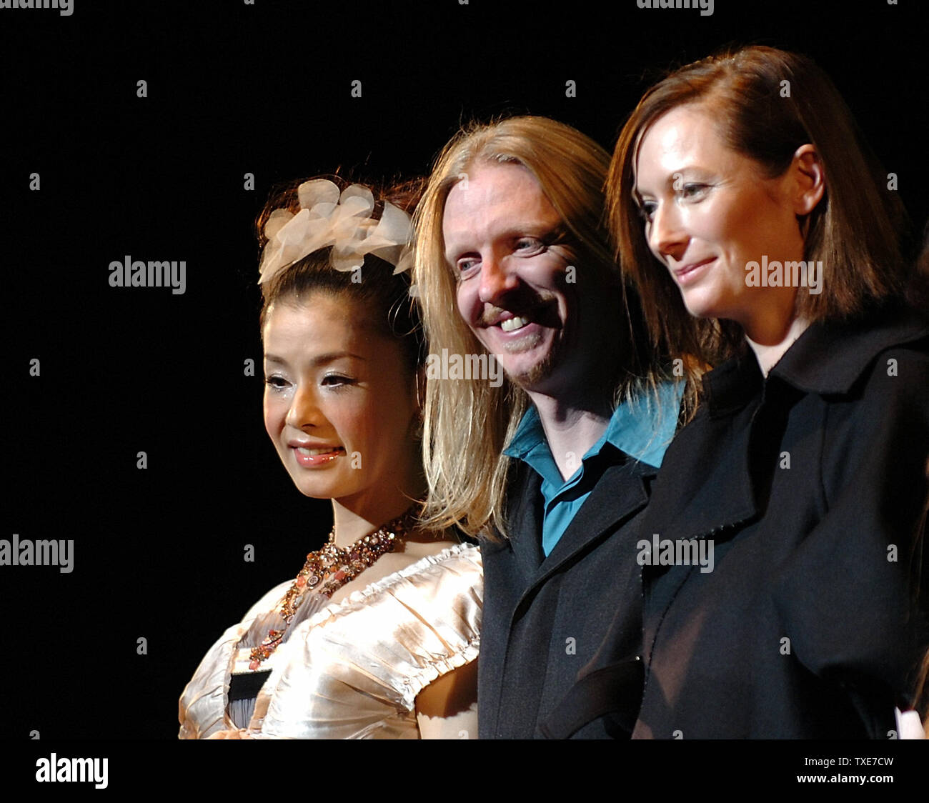 Posing for cameras are: film director Andrew Adamson, Japanese actress ...