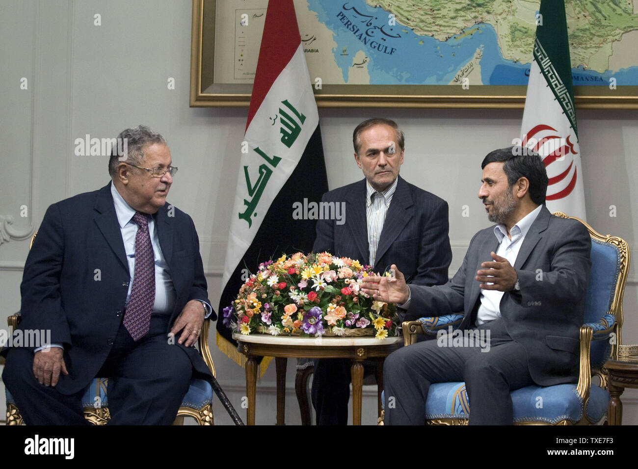 Iranian President Mahmoud Ahmadinejad(R) speaks with Iraqi president ...