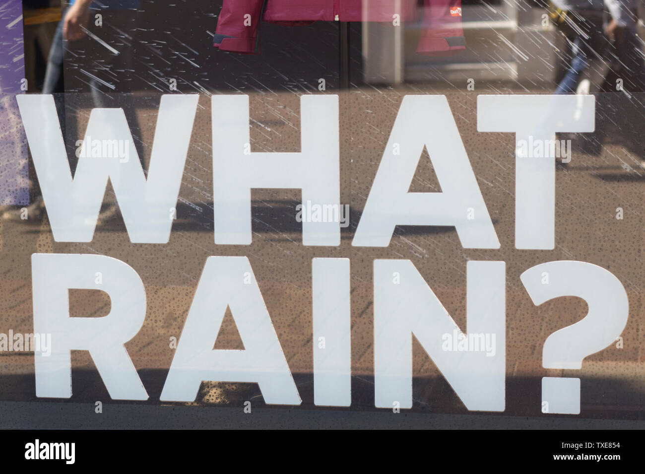 what rain ?, sign in a shop window Stock Photo - Alamy
