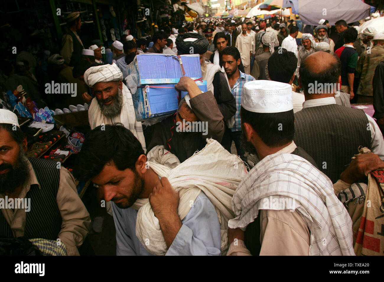 People move through a bazaar in Kabul, Afghanistan on September 15 ...
