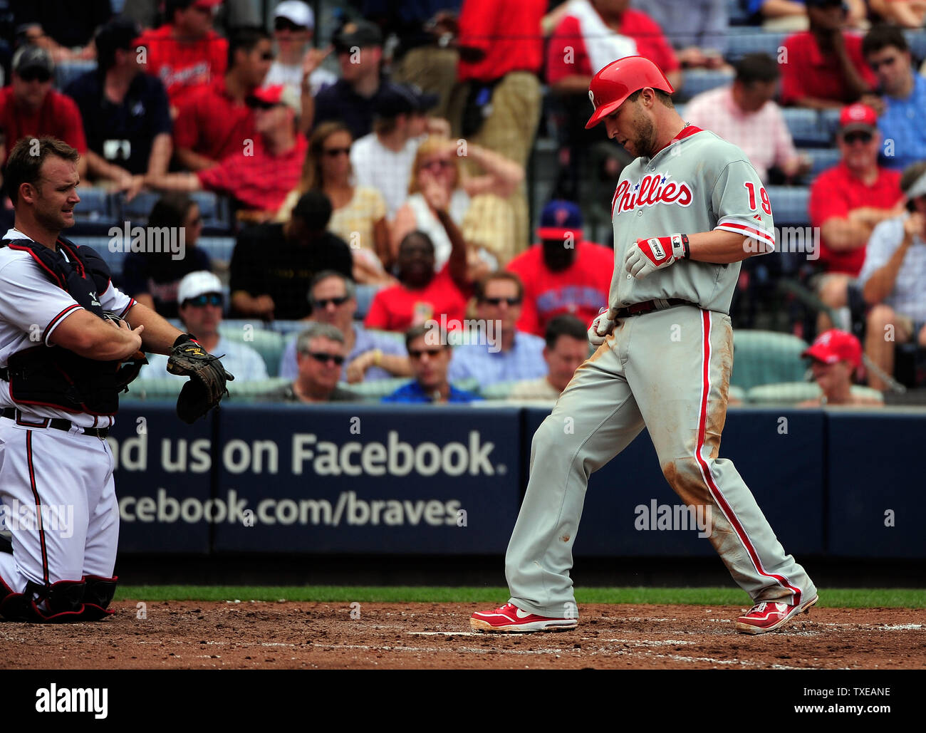 Philadelphia Phillies batter Laynce Nix (19) crosses the plate in front ...