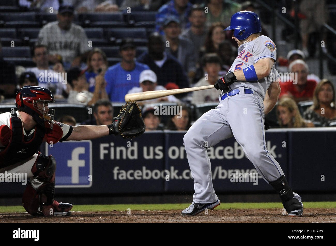 New York Mets batter David Wright is hit by a pitch from Atlanta Braves ...