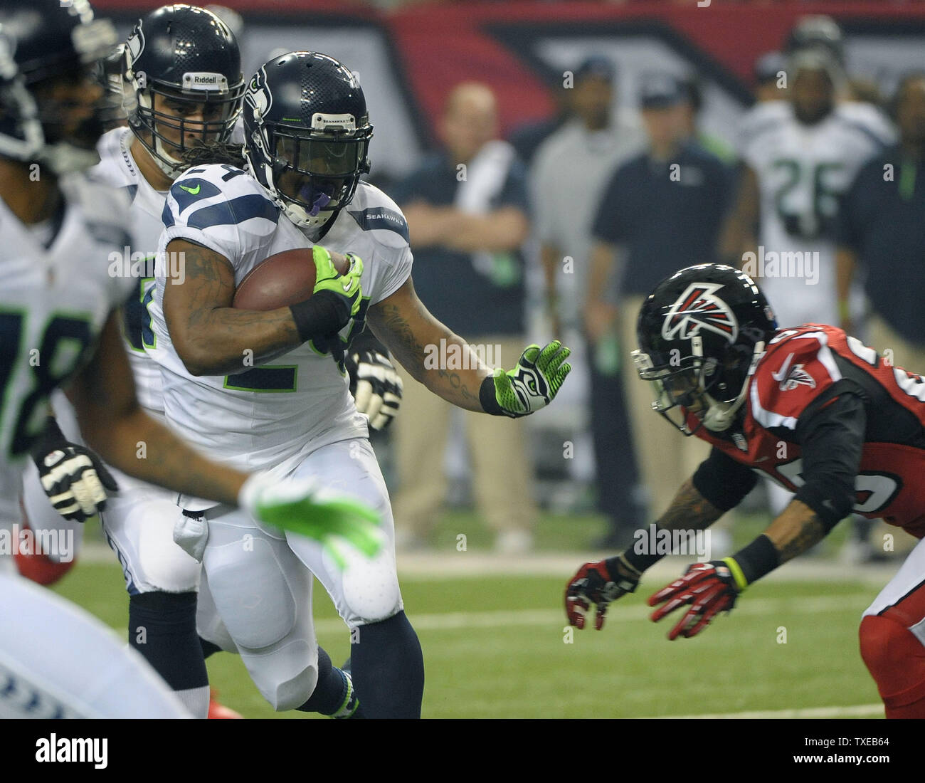 Seattle Seahawks' Marshawn Lynch (24) dodges Atlanta Falcons safety ...