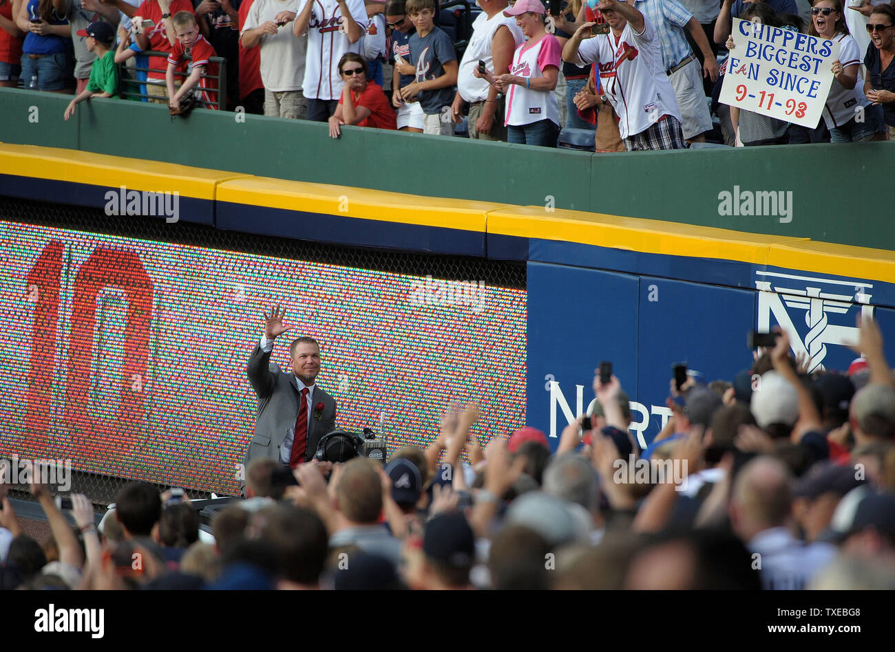 Fans wave to former Atlanta Braves third baseman Chipper Jones as he is ...