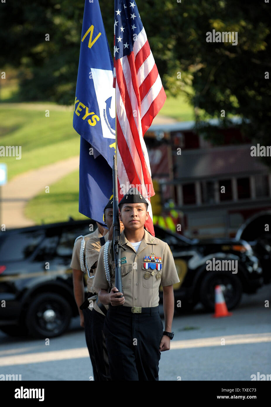 The US flag is presented by the Cross Keys High School ROTC, led by ...