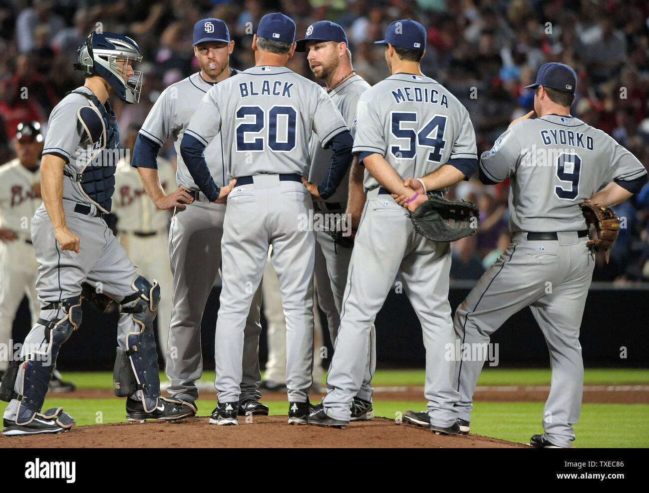 San Diego Padres pitcher Dale Thayer (C) joins the mound conference ...