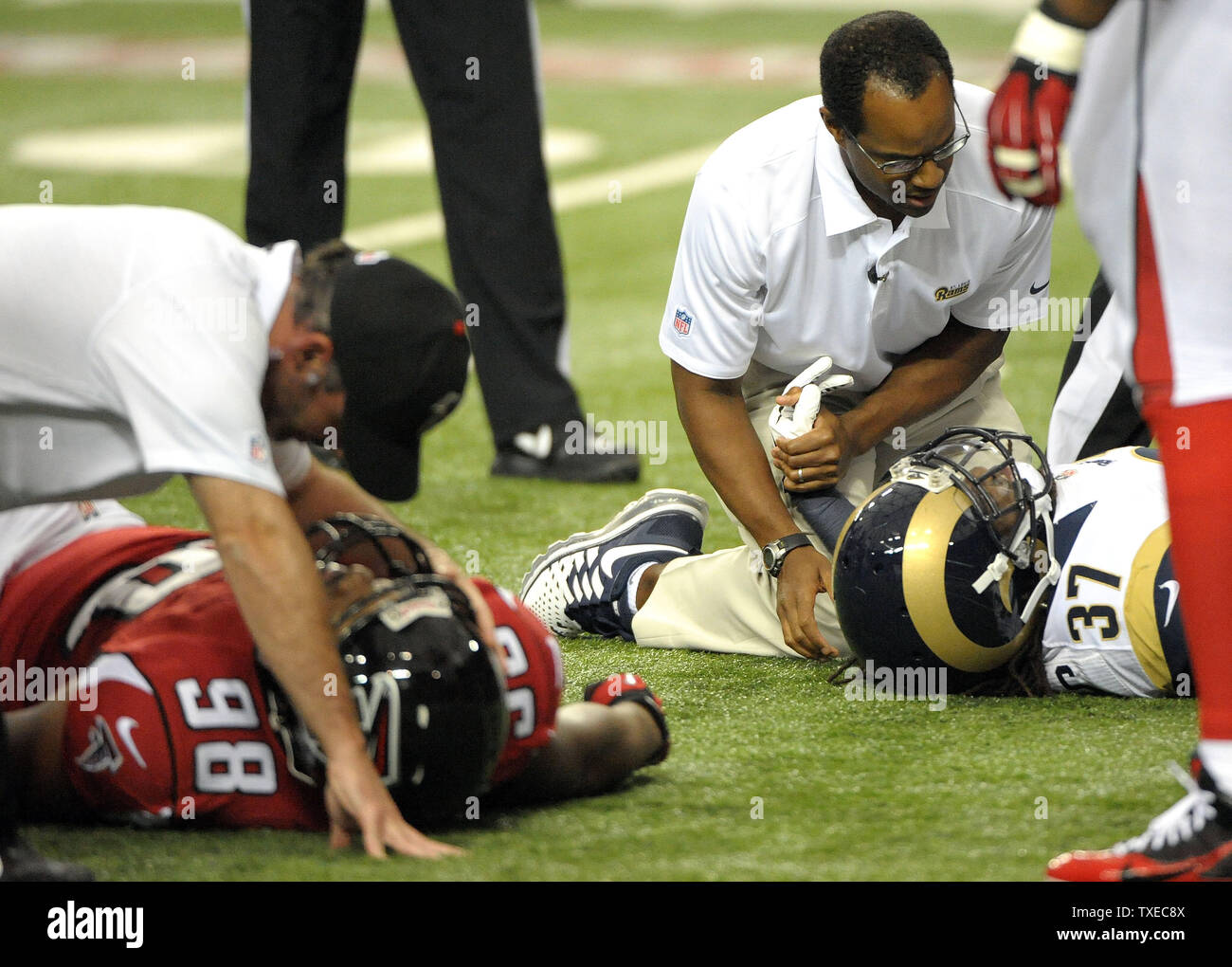St. Louis Rams safety Matt Daniels (37) and Atlanta Falcons end Cliff ...