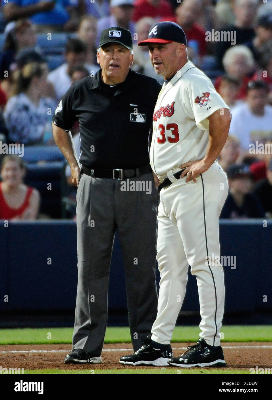 Atlanta Braves manager Fredi Gonzalez (33) requests umpire Larry ...