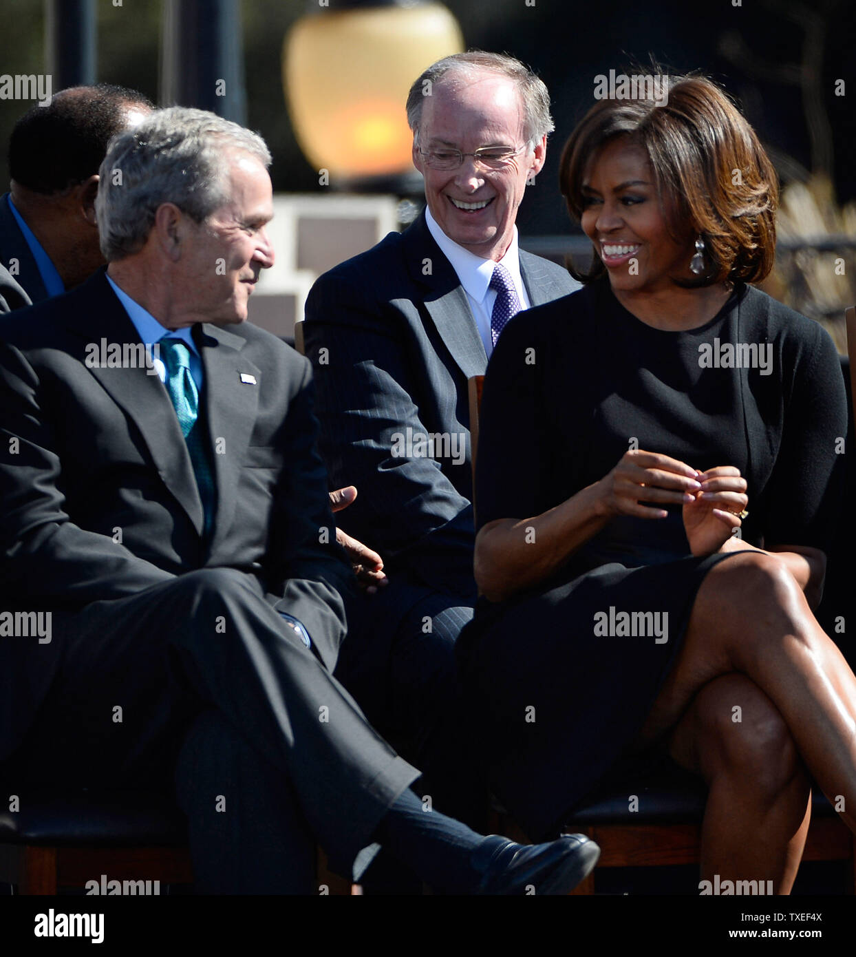 First Lady Michelle Obama (R) smiles with President George W. Bush ...