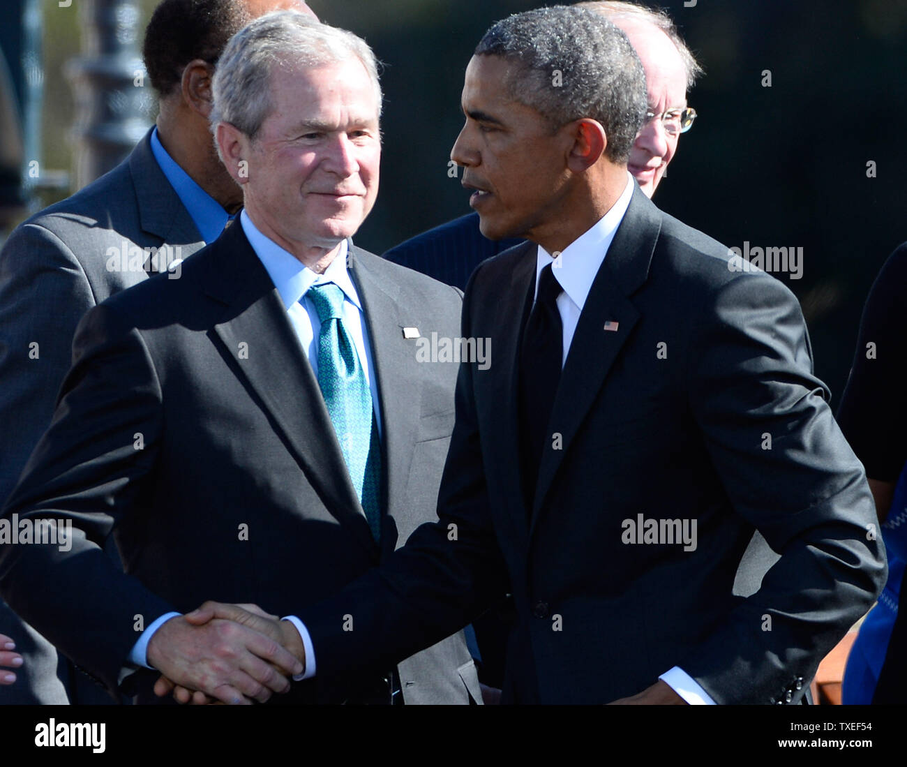 President Barack Obama (R) greets President George W. Bush during a ...