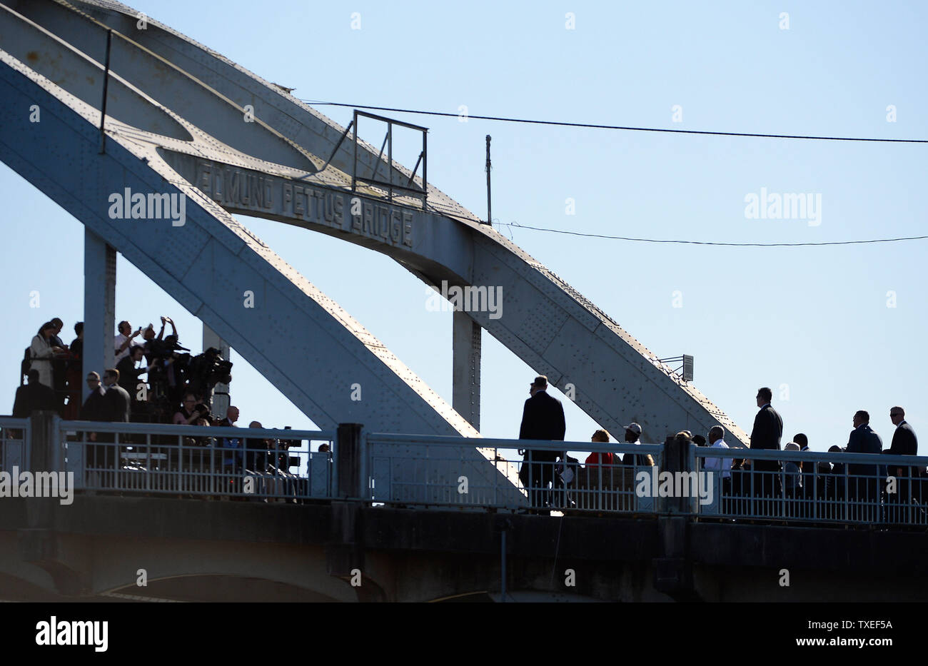 President Barack Obama's entourage walks across the historic Edmund ...