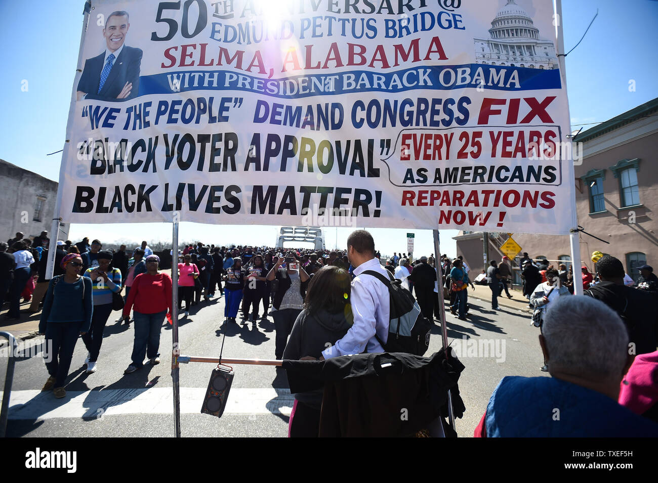 People pose for photos at the foot of the Edmund Pettus Bridge during ...
