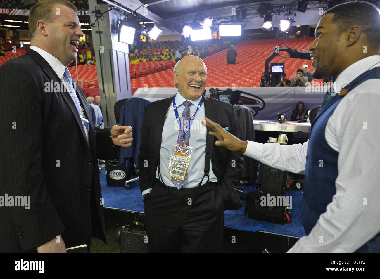 Fox NFL television hosts Jon Runyan, Terry Bradshaw, and Michael ...