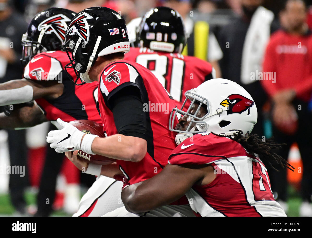 Arizona Cardinals defensive end Markus Golden (R) sacks Atlanta Falcons ...