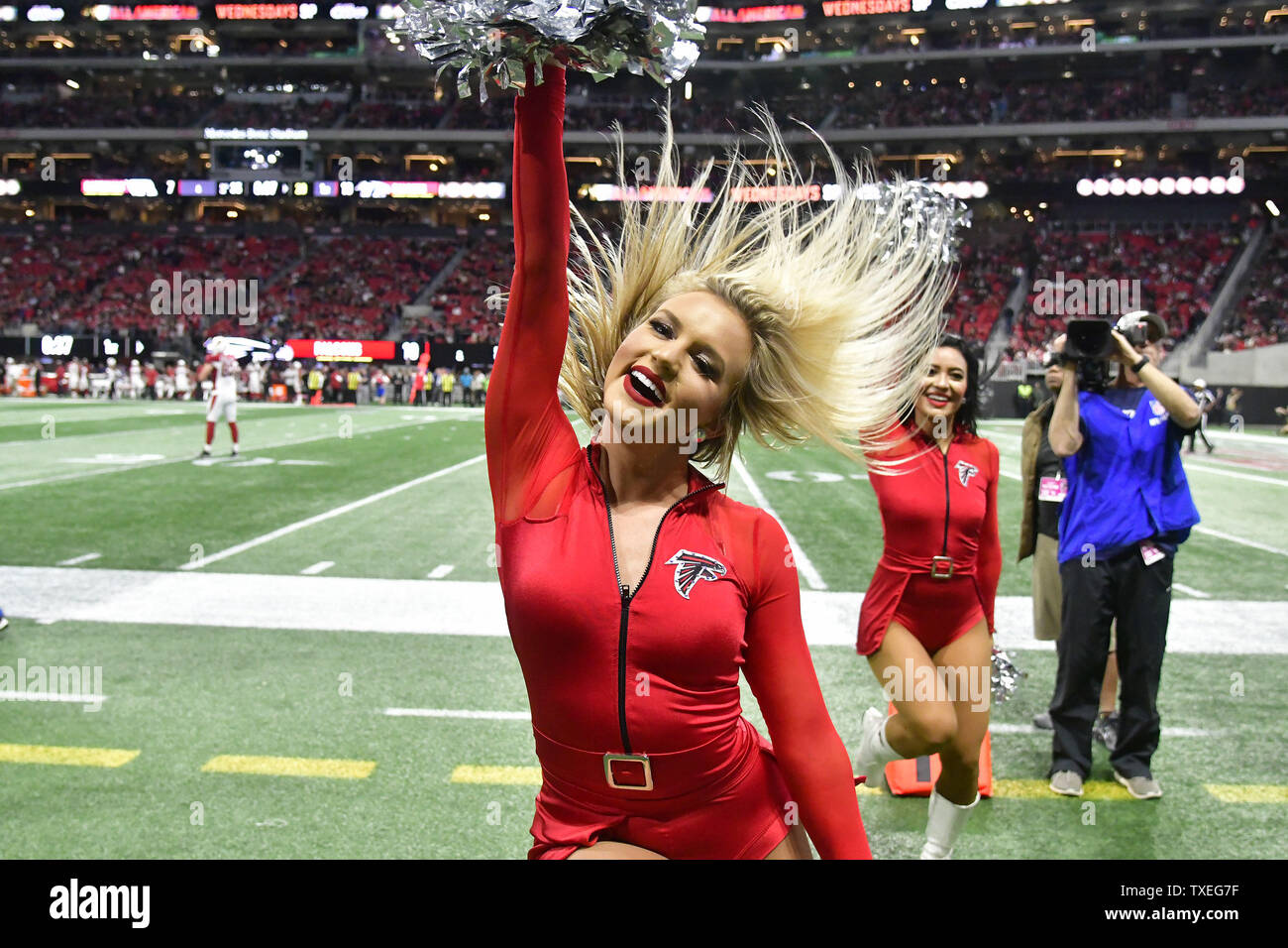 An Atlanta Falcons cheerleader performs during the first half of an NFL ...