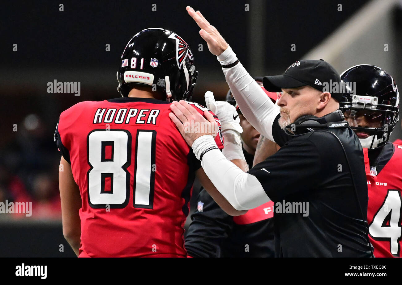 Atlanta Falcons head coach Dan Quinn (R) celebrates with tight end ...