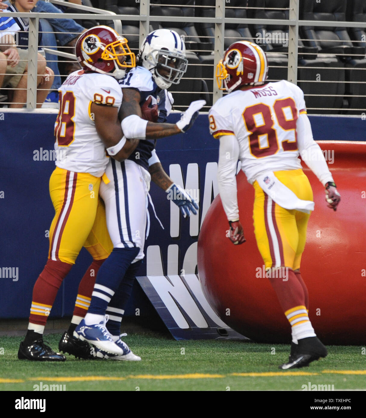 Dallas Cowboys Mike Jenkins gets restrained by Washington Redskins ...