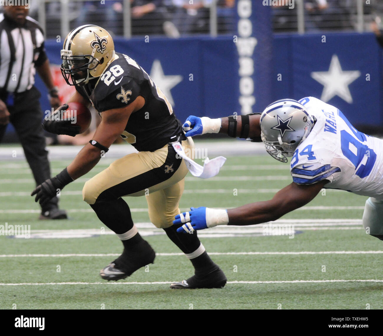 New Orleans Mark Ingram gets away from Dallas Cowboys DeMarcus Ware ...