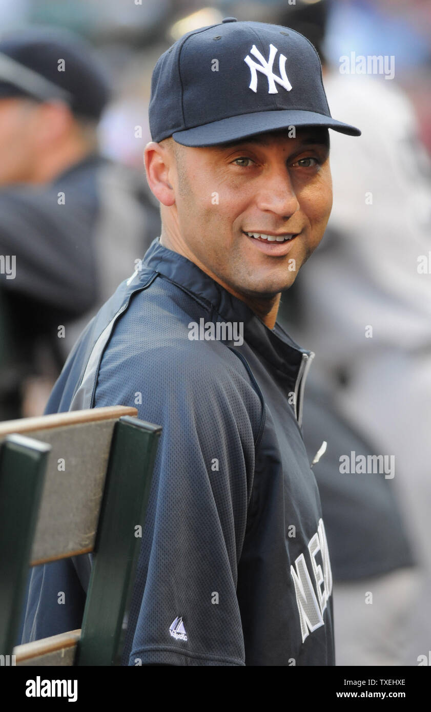 New Yankees Derek Jeter laughs in the dugout as his team battles the ...