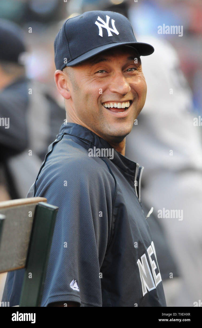 New Yankees Derek Jeter laughs in the dugout as his team battle the ...
