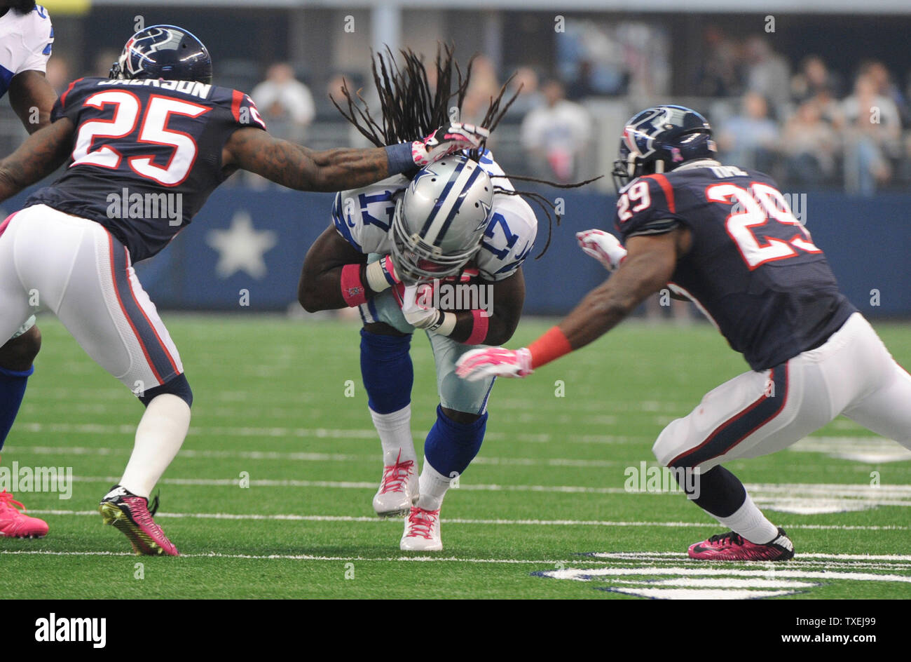 Dallas Cowboys Dwayne Harris lunges forward as Houston Texans Kareem ...