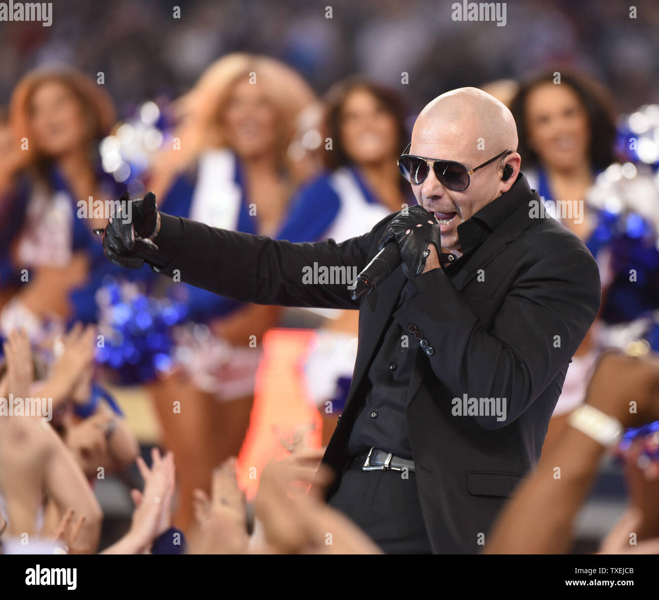 Rapper Pittbull performs during halftime of the Dallas Cowboys and ...