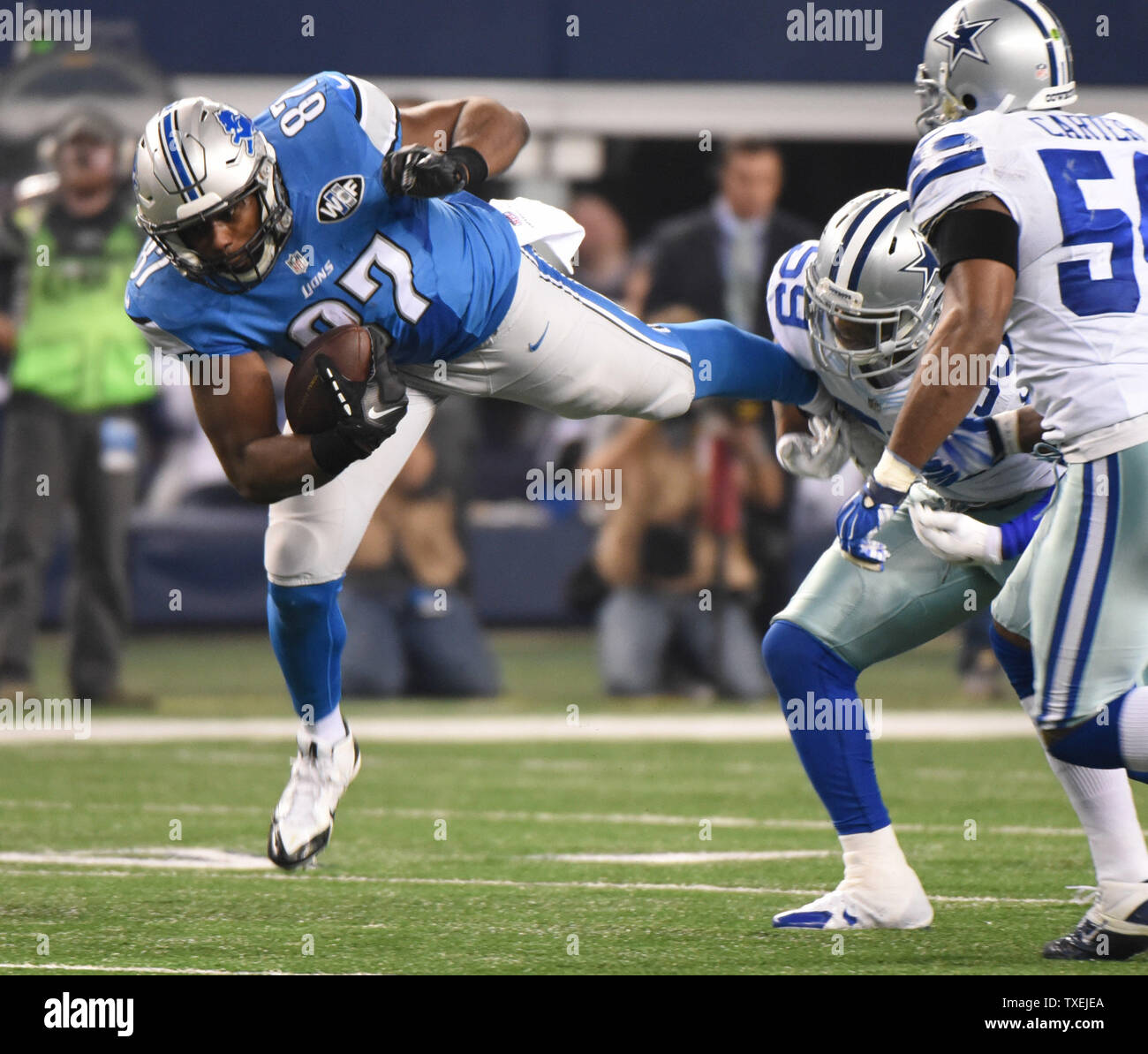 Detroit Lions Brandon Pettigrew gets tripped upt by Dallas Cowboys ...
