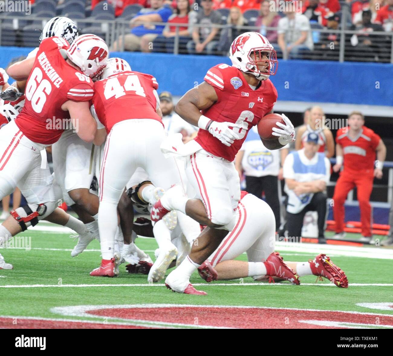 Wisconsin Badgers quarterback Bart Houston celebrates after throwing a ...