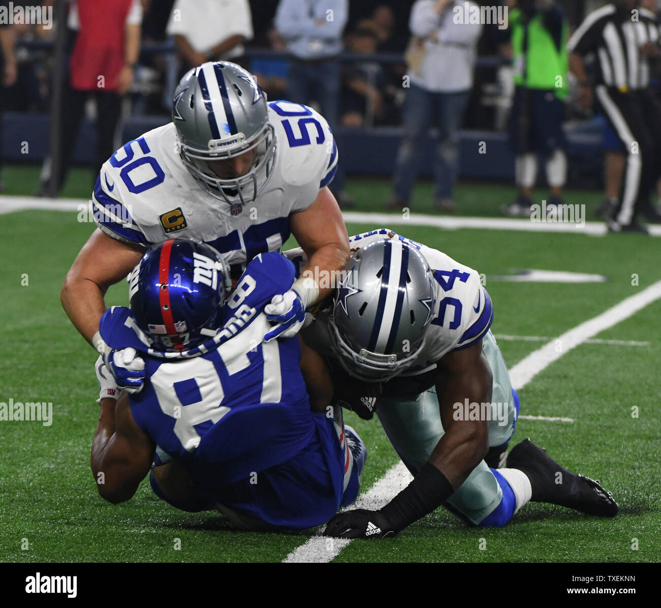 Dallas Cowboys Sean Lee (50) and Jaylon Smith (54) wrap up the New York ...