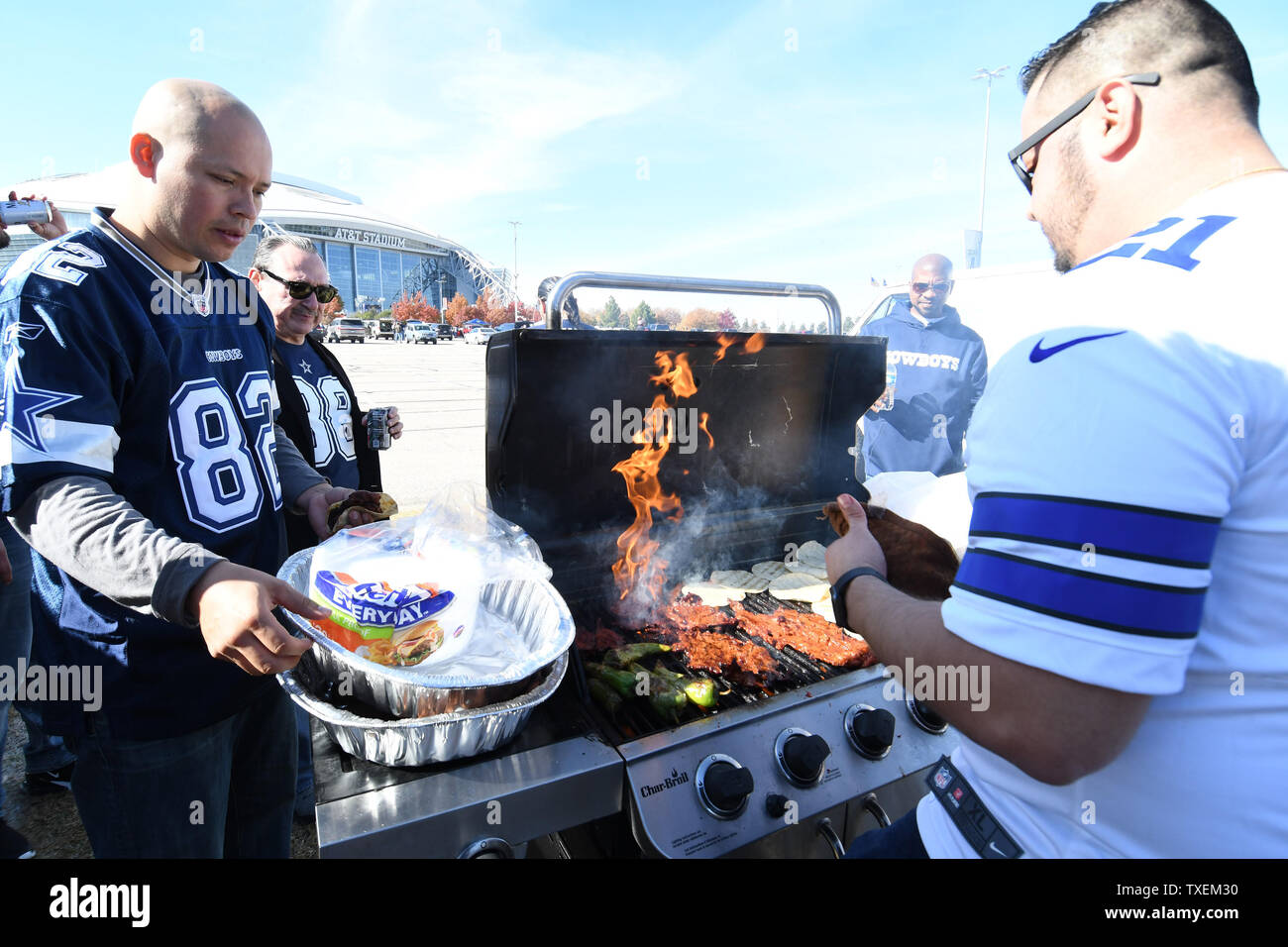 Fans spend their Thanksgiving tailgating prior to the Dallas Cowboys ...