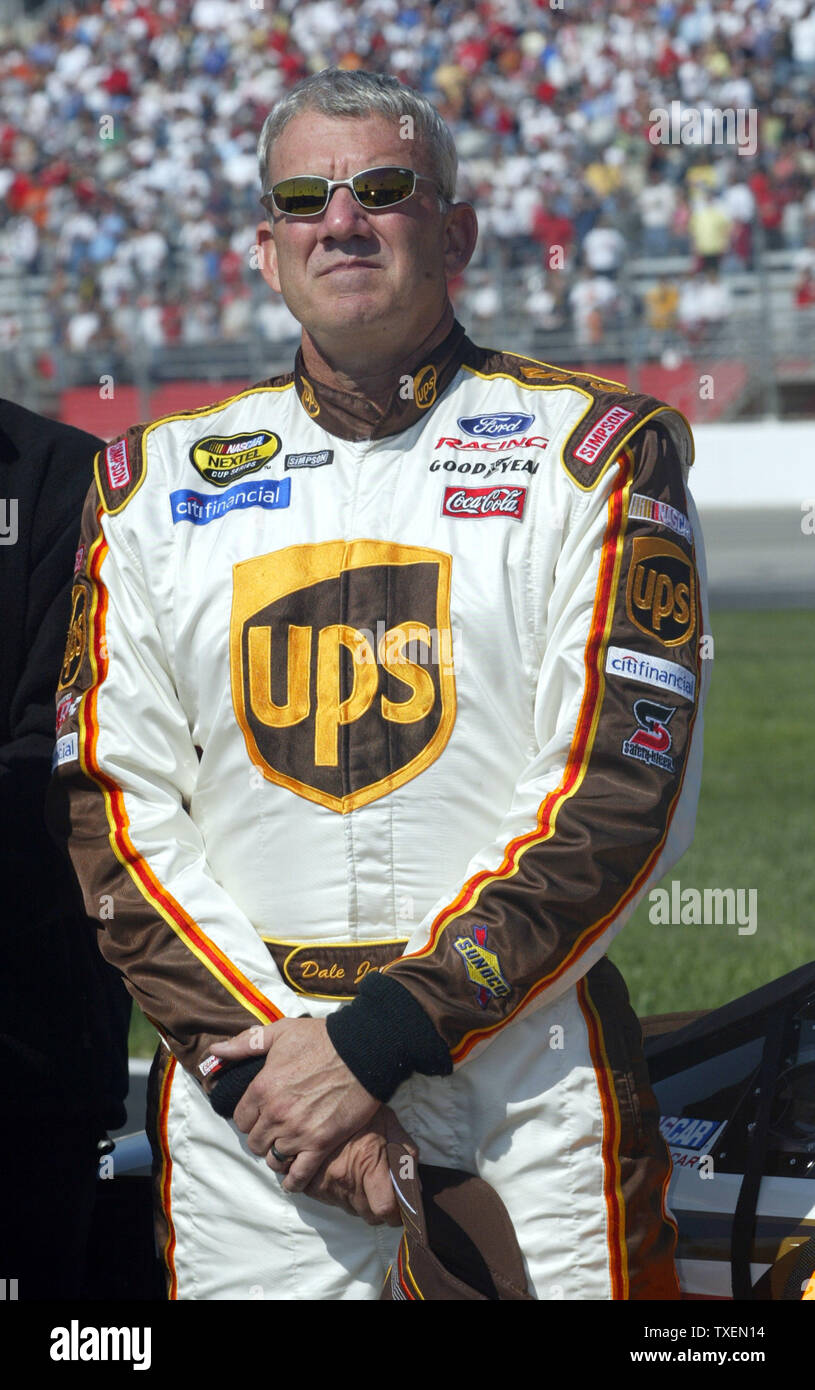 Race car driver Dale Jarrett stands by his car during the National ...