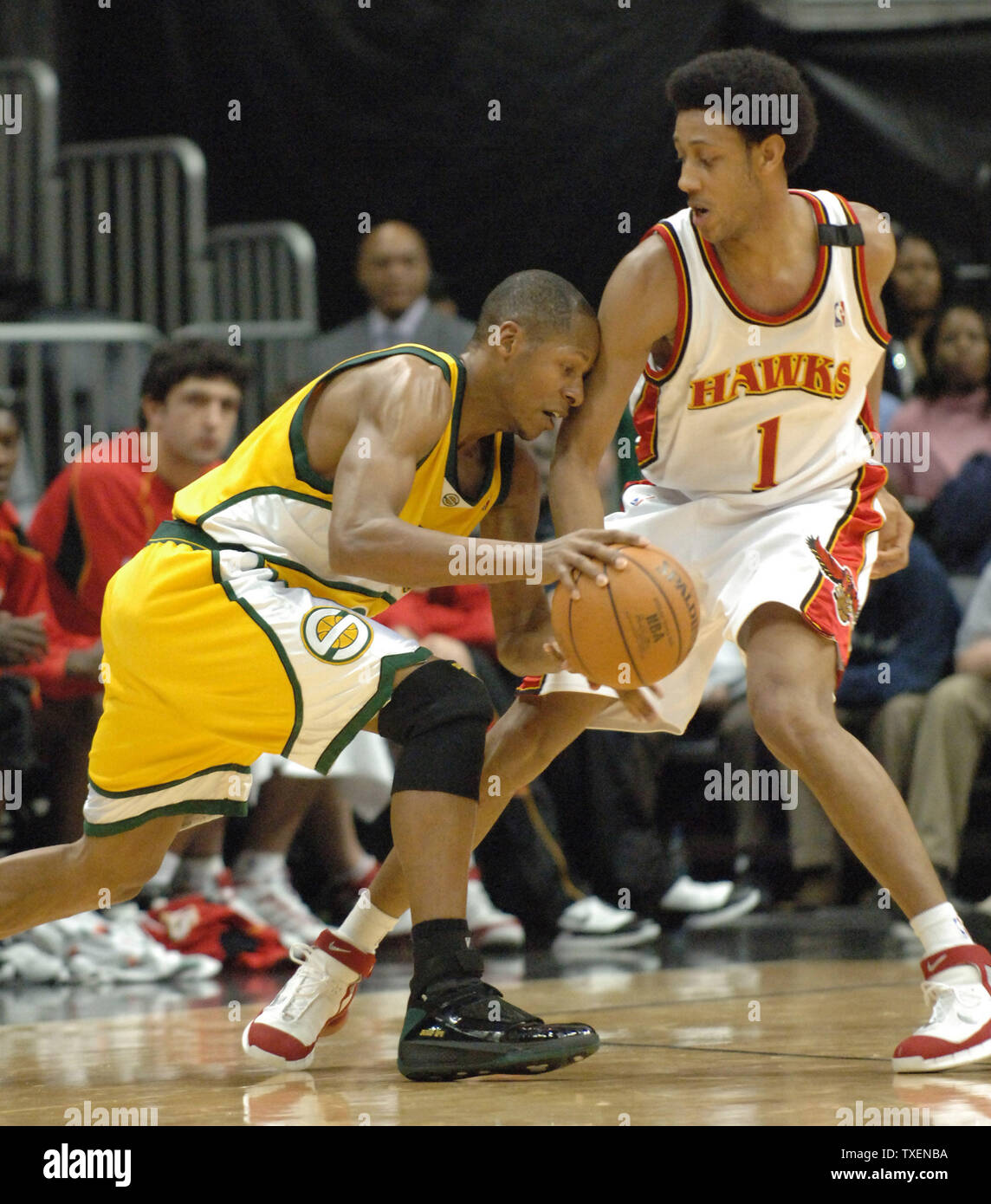 Seattle Sonics Ray Allen (34) shoves hard into Atlanta Hawks Josh ...