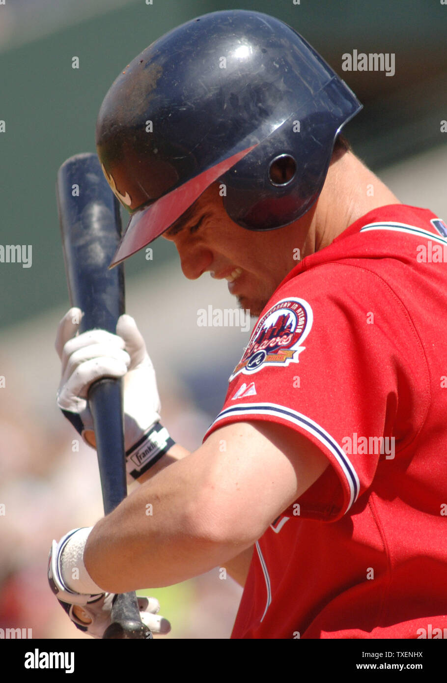 Atlanta Braves Marcus Giles grimaces in 7th after missing a pitch in ...