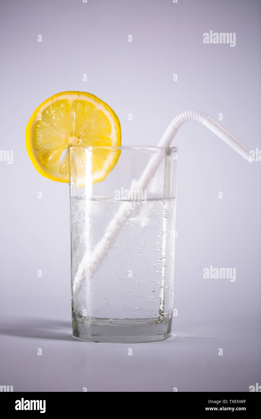 In summer, a cold drink and a slice of lemon Stock Photo - Alamy