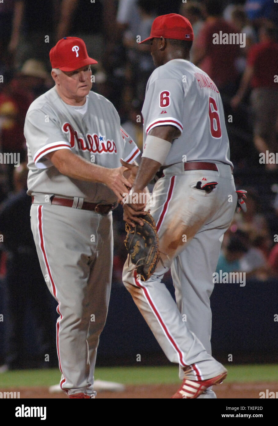 Philadelphia Phillies manager Charlie Manuel congratulates Ryan Howard ...