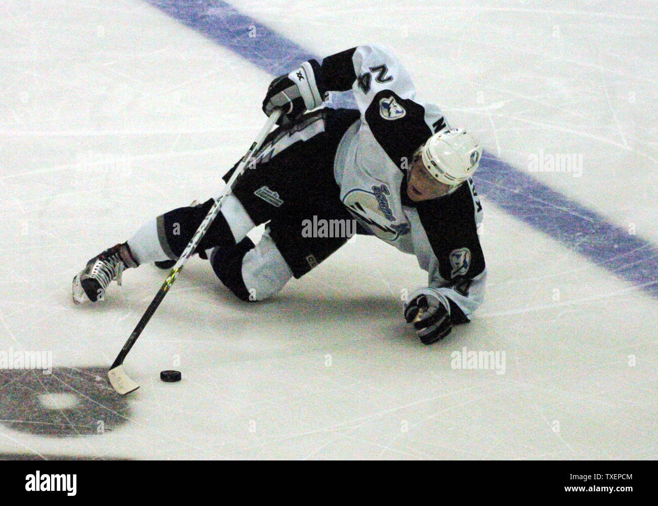Tampa Bay Lightning Andreas Karlsson falls to the ice while bringing ...