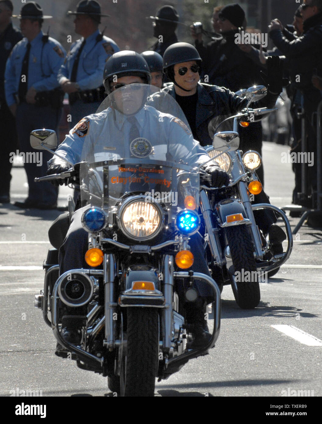 "Wild Hogs" star John Travolta (R) rides behind a Georgia State Patrol ...
