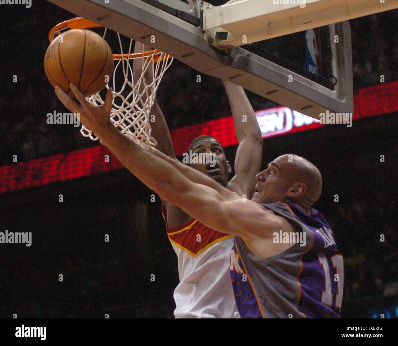 Phoenix Suns Pat Burke (11) puts two up past Atlanta Hawks Solomon ...