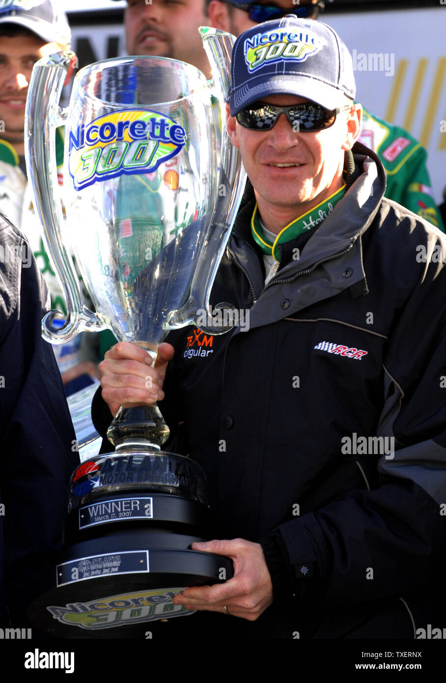 Jeff Burton, driver of the Holiday Inn Chevrolet holds up the winner's ...