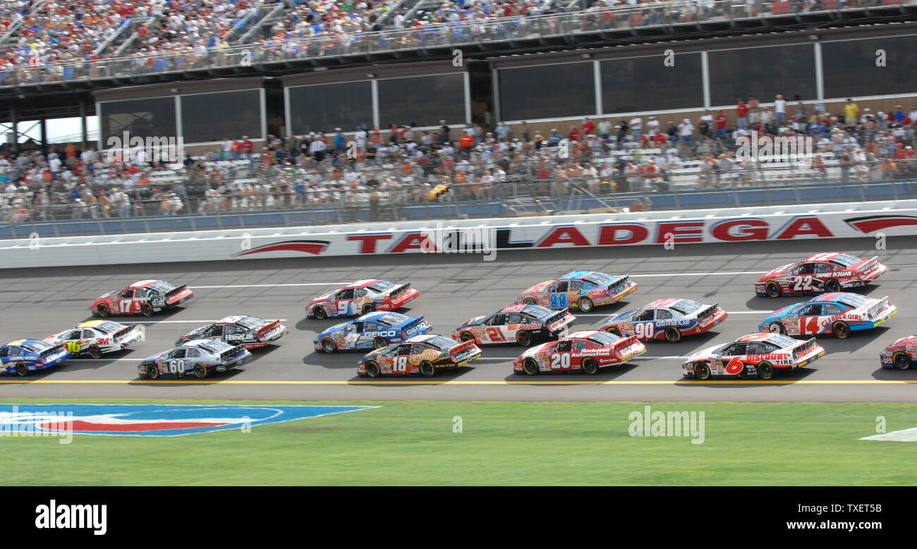 A three-wide field races in the front straight during the Aaron's 312 ...