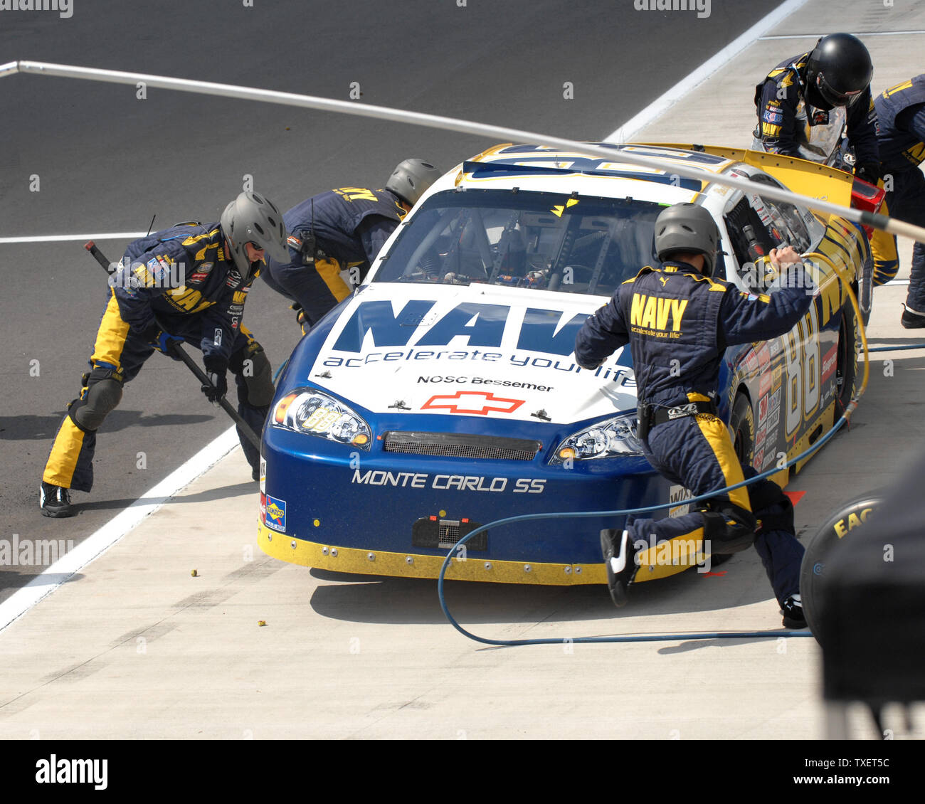 Shane Huffman, in the U.S. Navy Chevrolet, makes an early pit stop ...