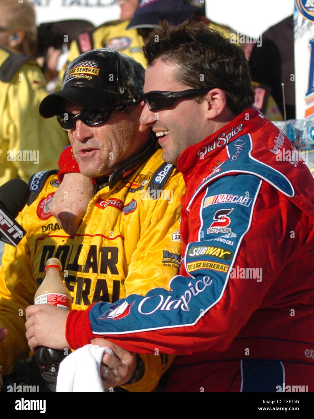 Race winner Bobby Labonte (L) is greeted by teammate and second-place ...