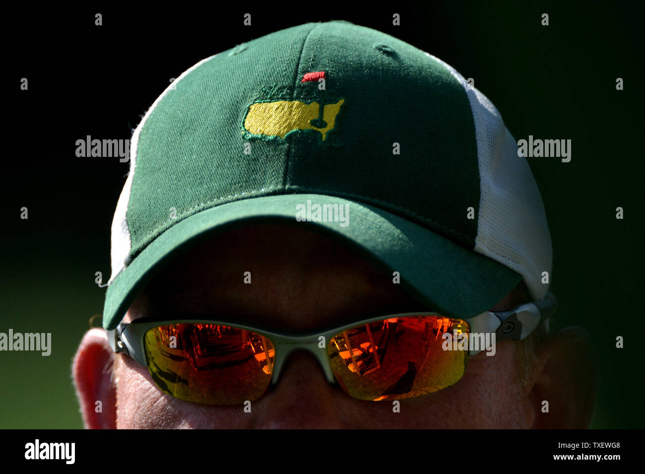 A golf patron watches play during a practice round before the Master ...