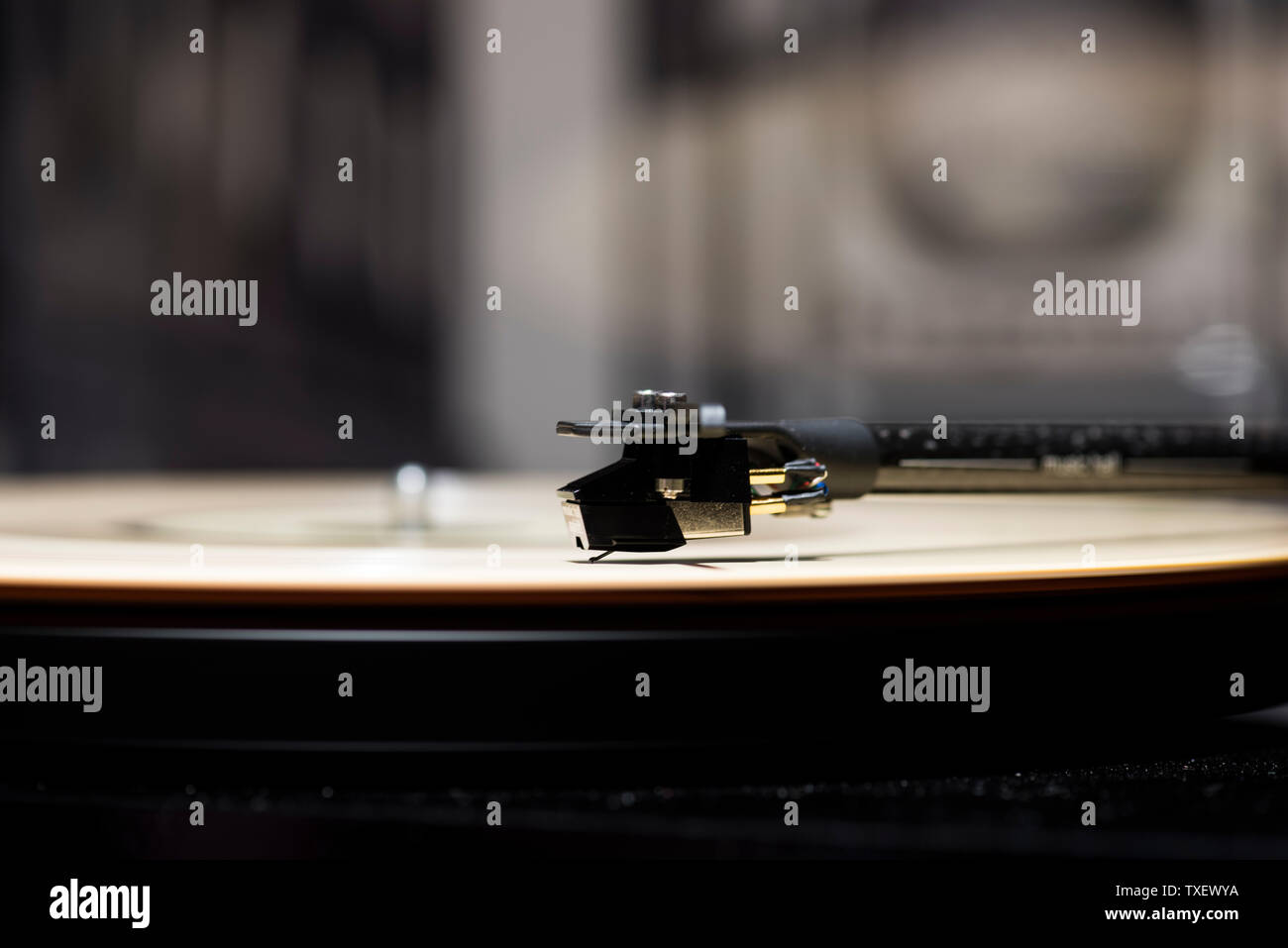 Turntable playing colored record Stock Photo - Alamy