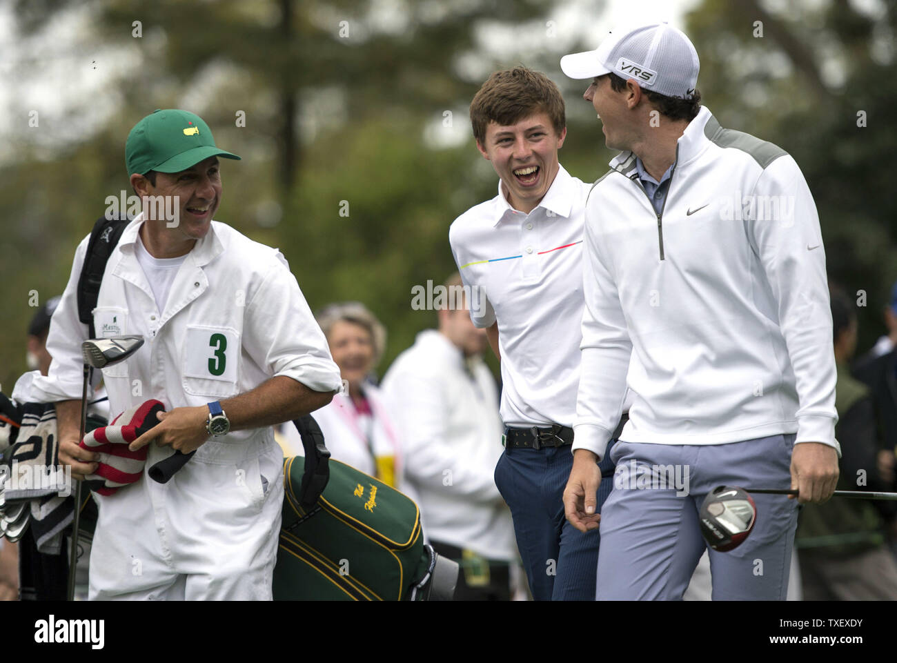 Rory McIlroy talks with amature Matthew Fitzpatrick (center) and ...