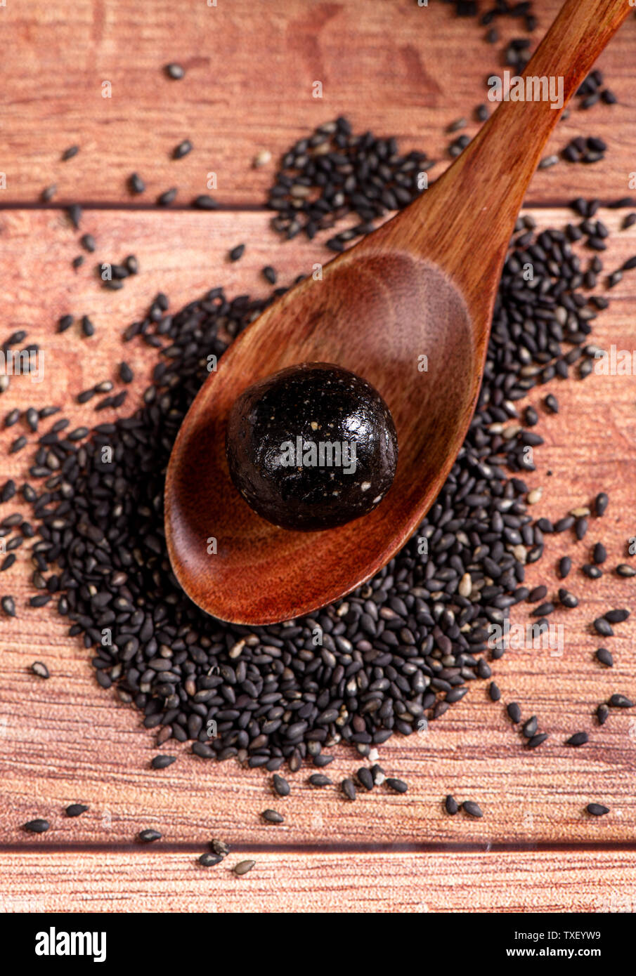 Black sesame pill Stock Photo - Alamy